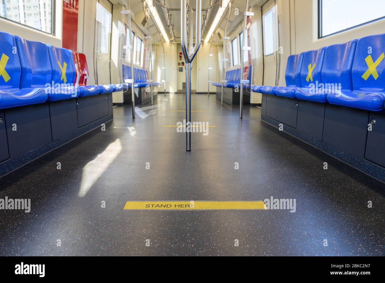 Stand lines on the floor in public train with social distancing protect ...