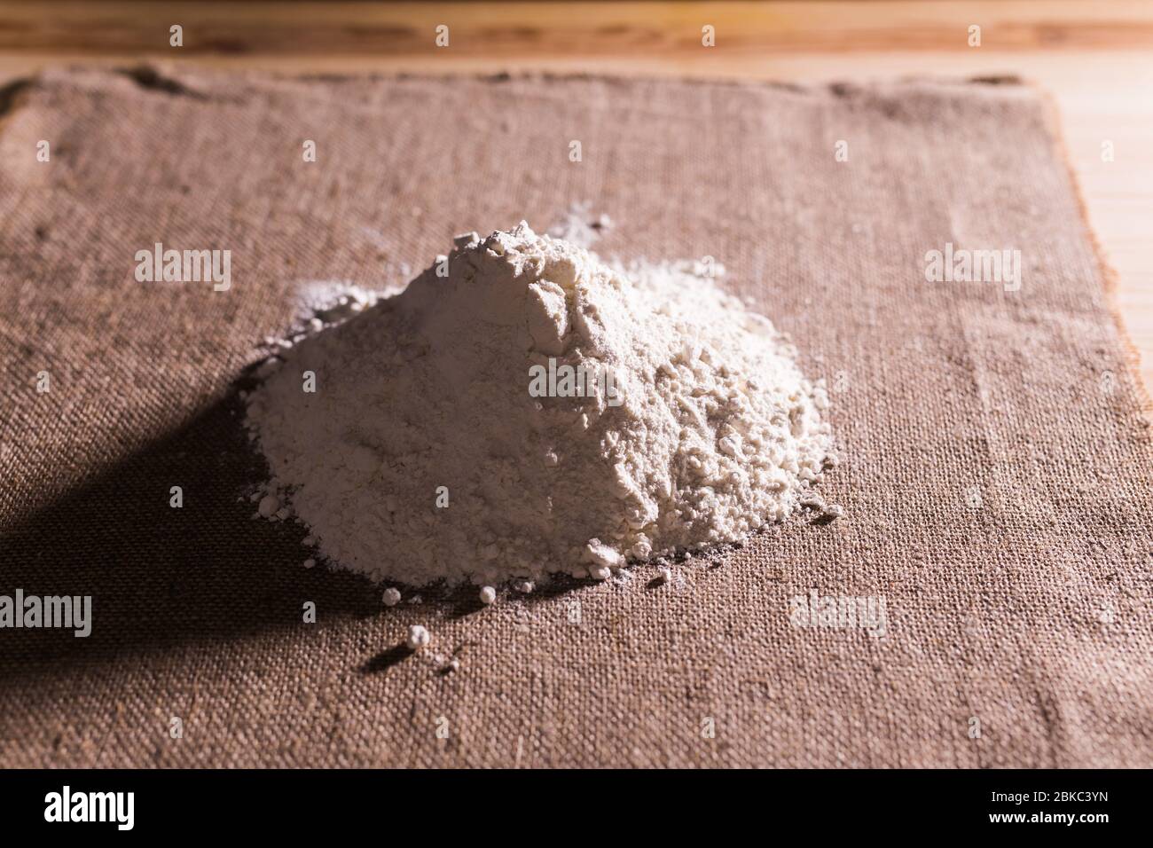 Heap of dry flour on textile. Cooking flour products concept Stock ...