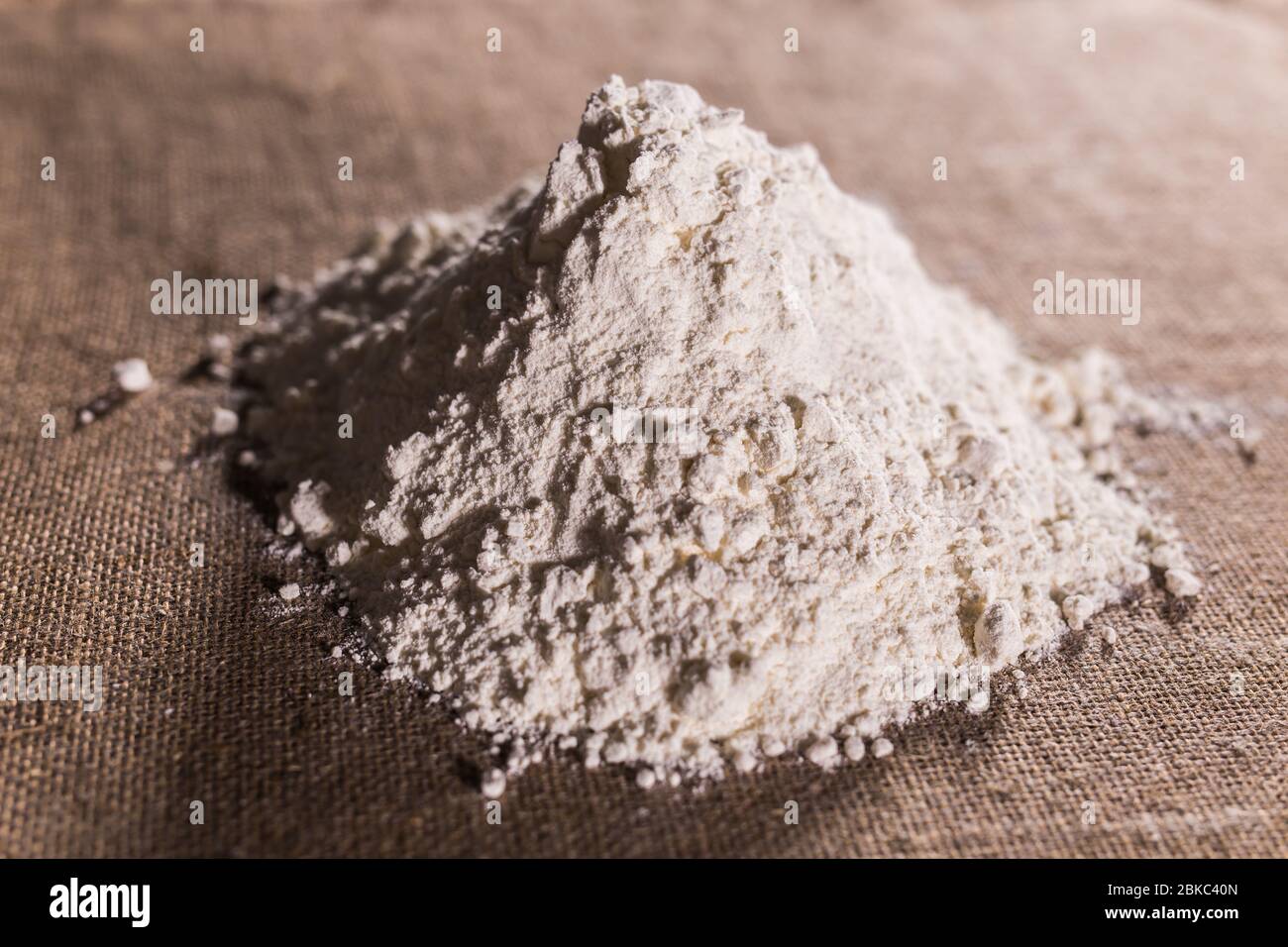 White flour on textile background texture photo Stock Photo - Alamy