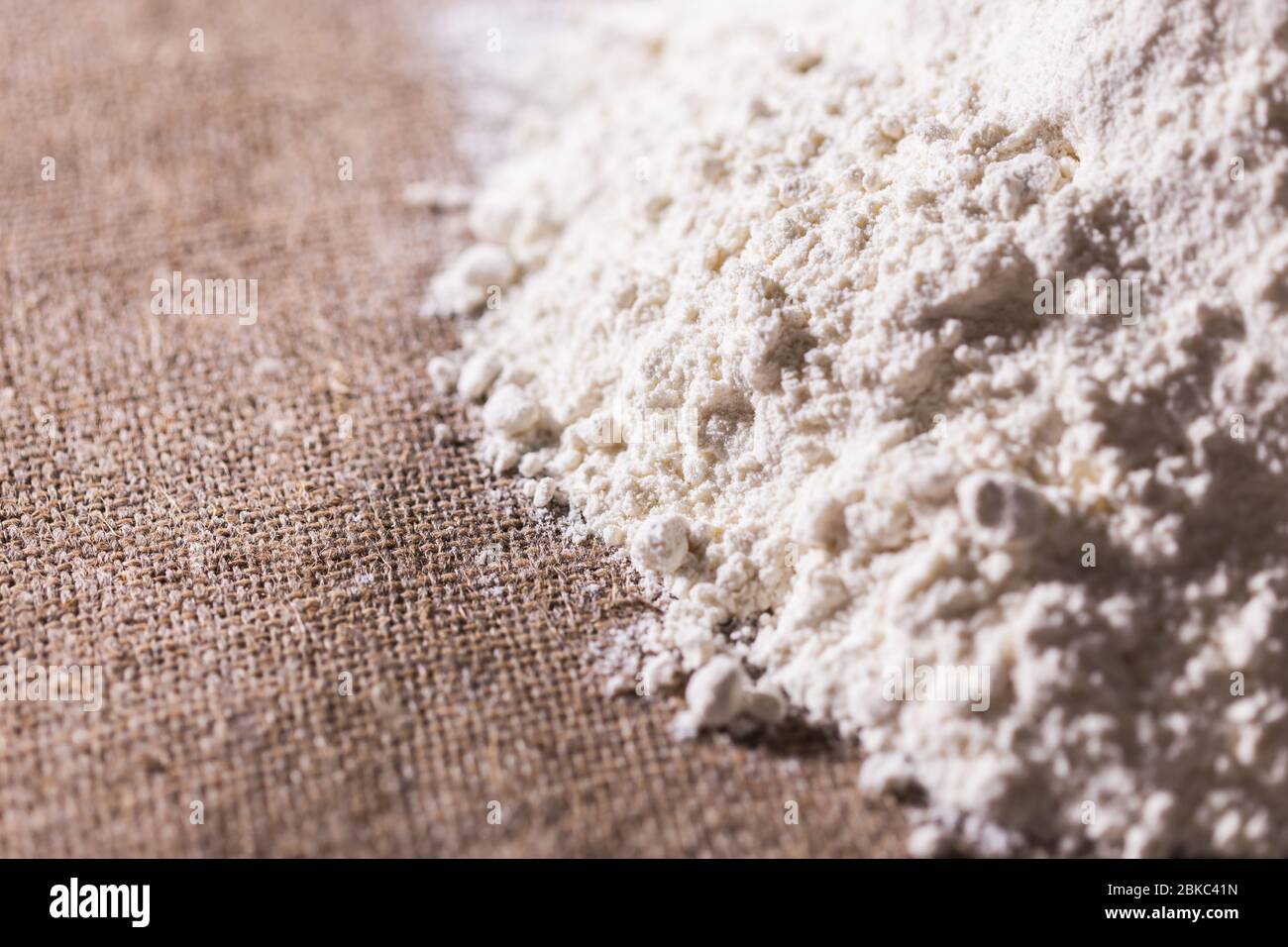 Heap of dry flour on textile. Cooking flour products concept Stock ...