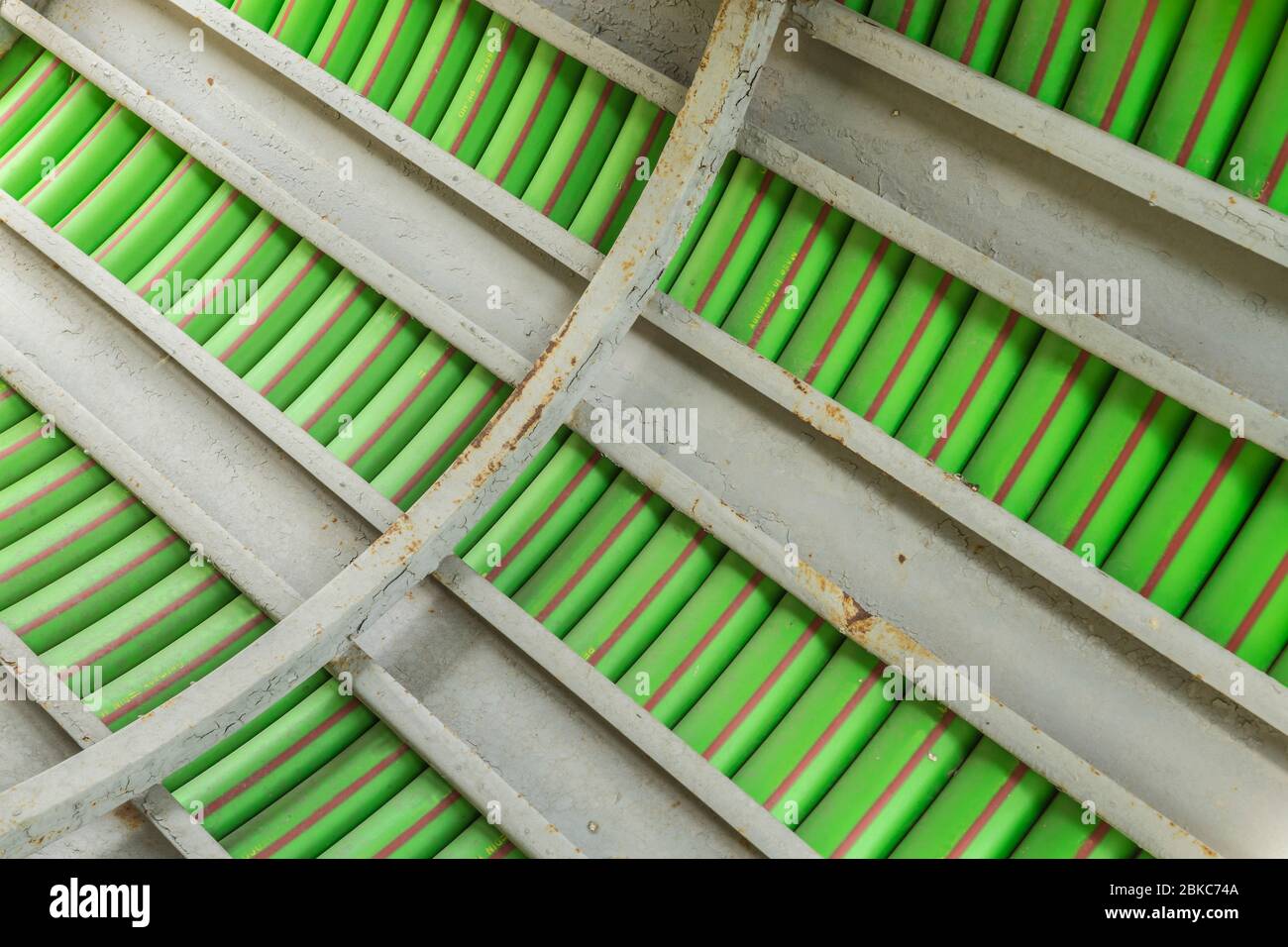 drum of cable protection hose Stock Photo - Alamy