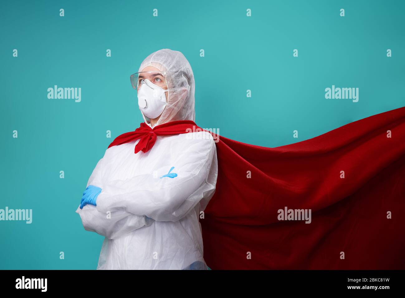 Doctor is wearing PPE - costume, gloves and surgical face mask in ...
