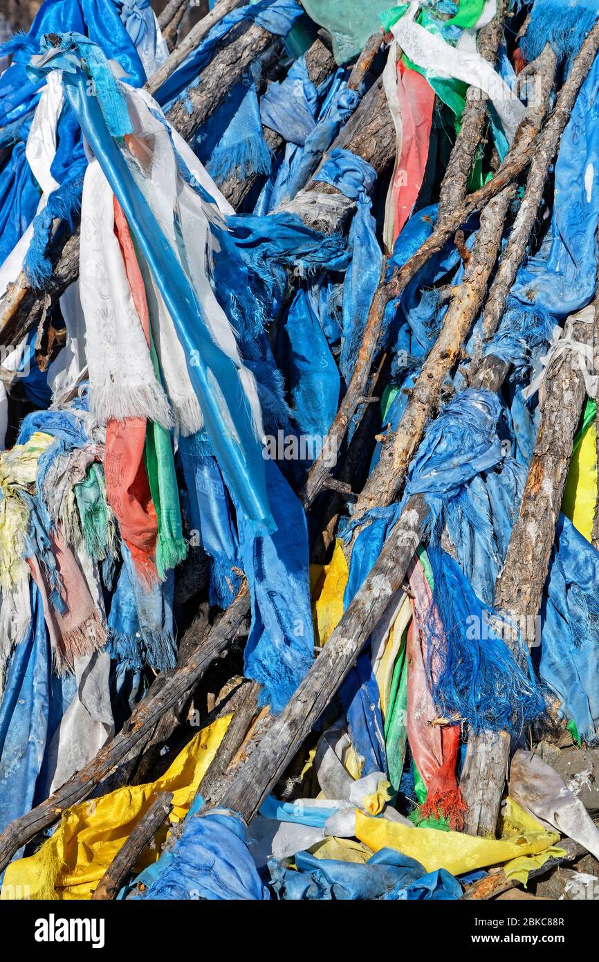 Flags in the wind. Ovoo are sacred stone heaps used as altars or ...