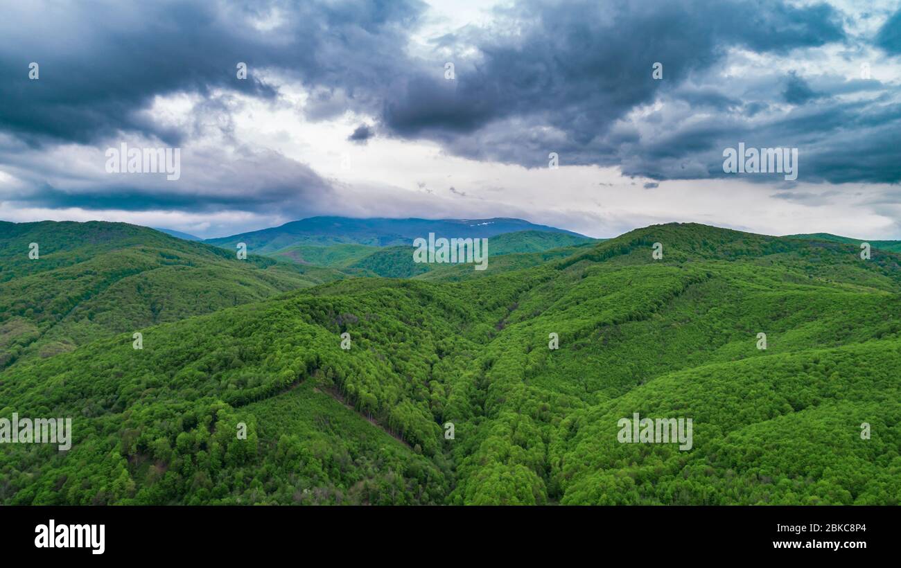 Spring landscape in mountains and the dark blue sky with clouds Stock ...