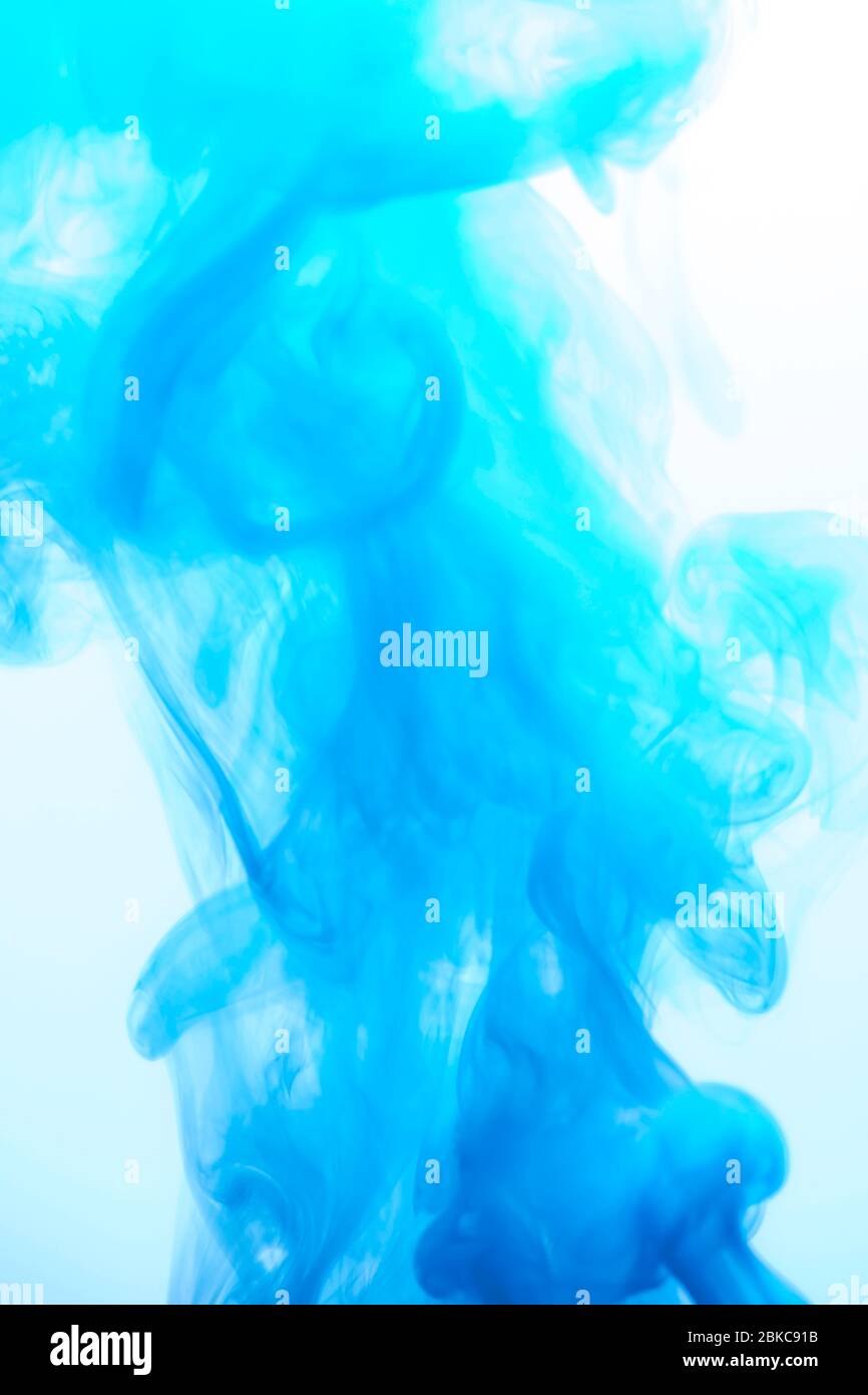 Blue smoking isolated on white background Stock Photo - Alamy