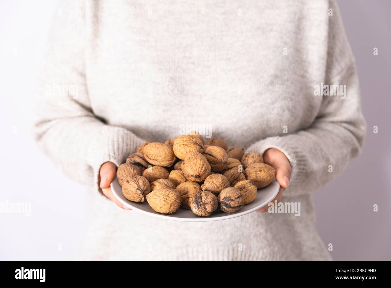 Walnuts woman hi-res stock photography and images - Alamy