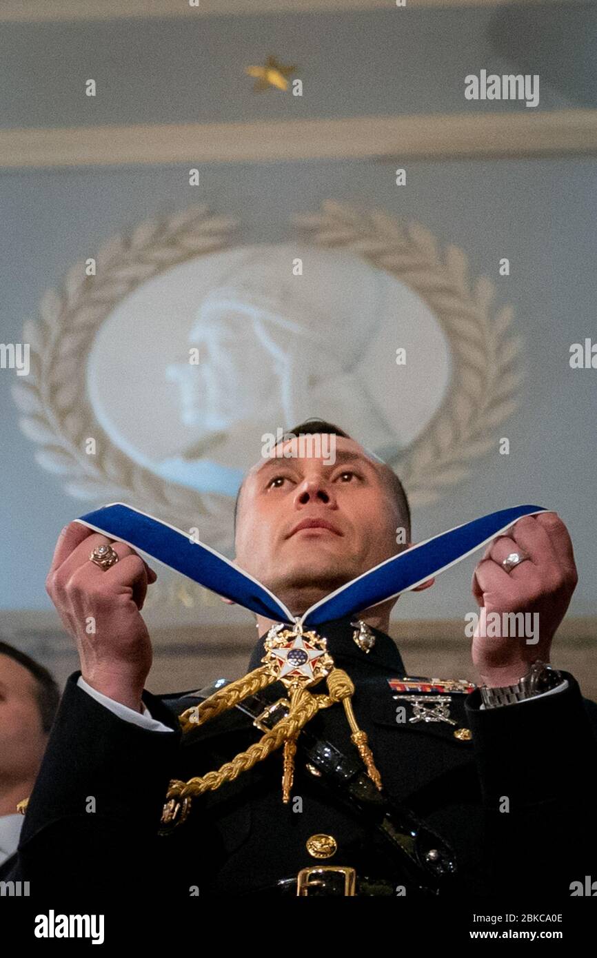 White House military aide U.S. Marine Lt. Col. Rogello Maese holds the ...