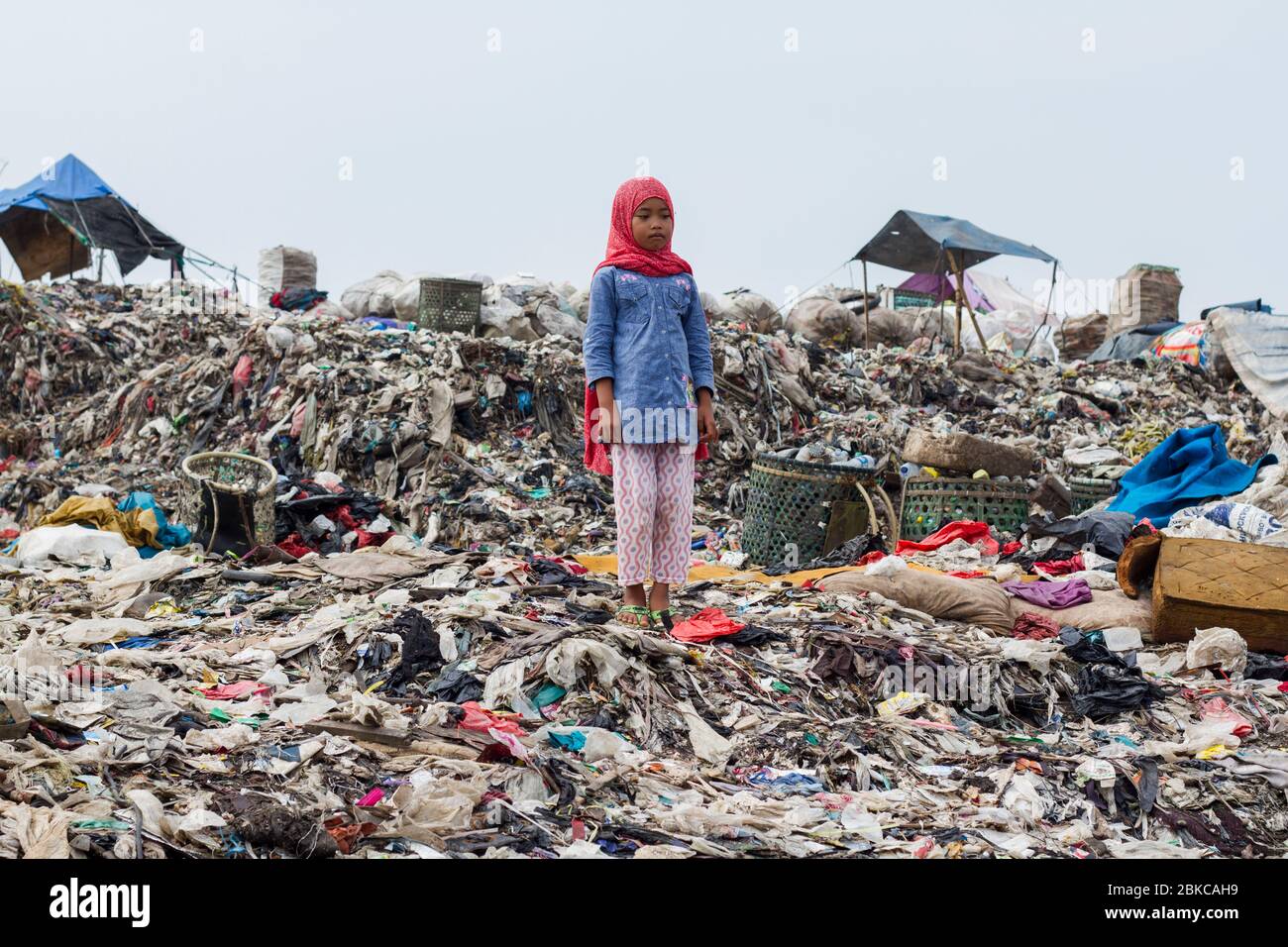 Bekasi, West Java, Indonesia. 3rd May, 2020. A daughter stands in a ...