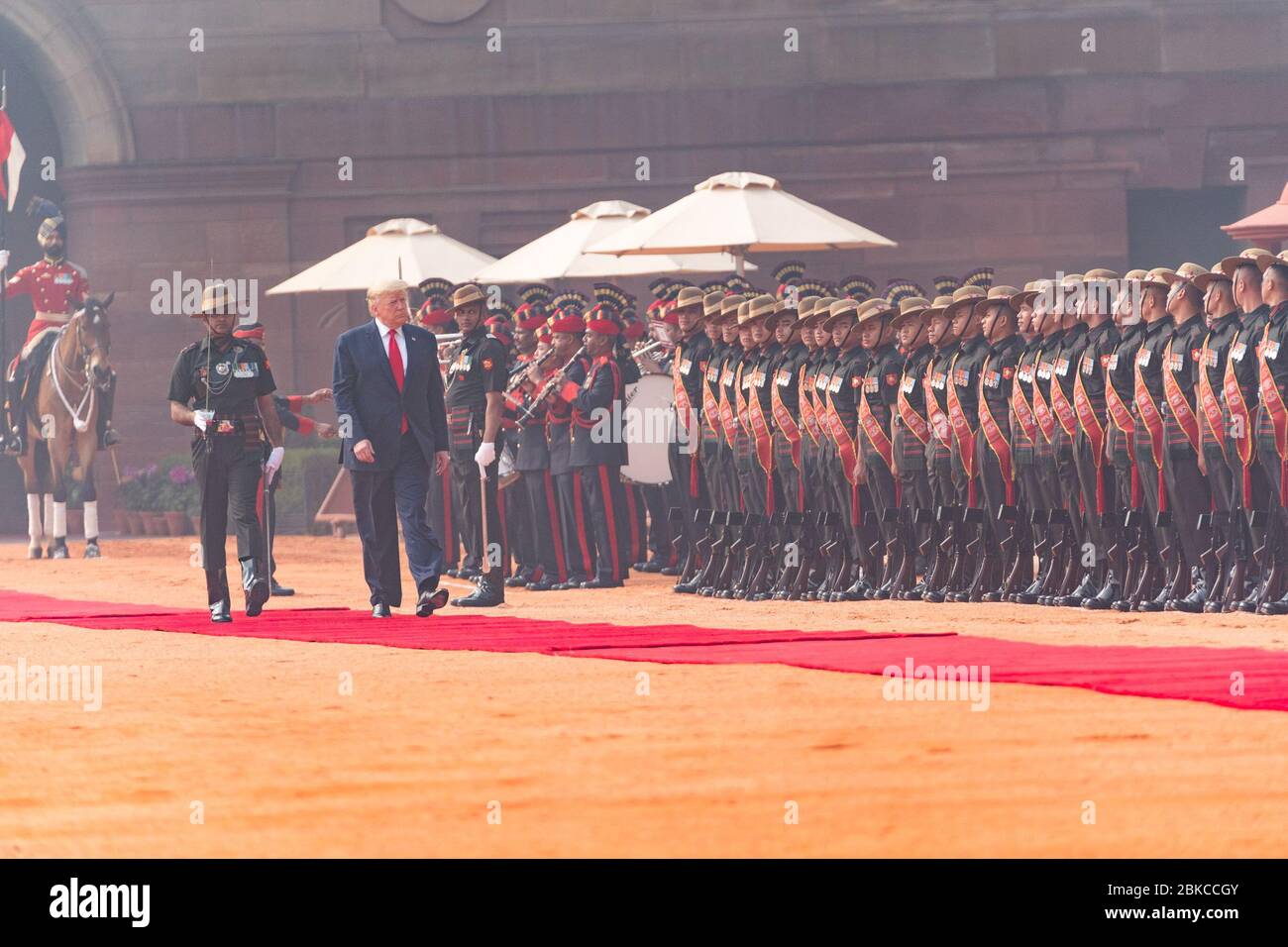 President Donald J. Trump is escorted by the Parade Commander to ...
