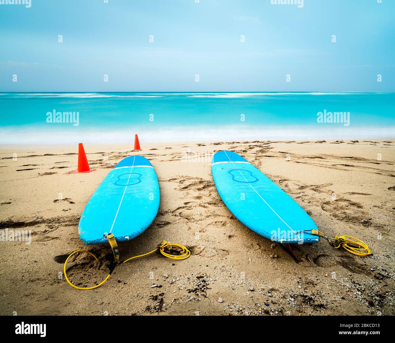 Two blue surfboards on the Waikiki Beach, Honolulu, Hawaii. With two ...