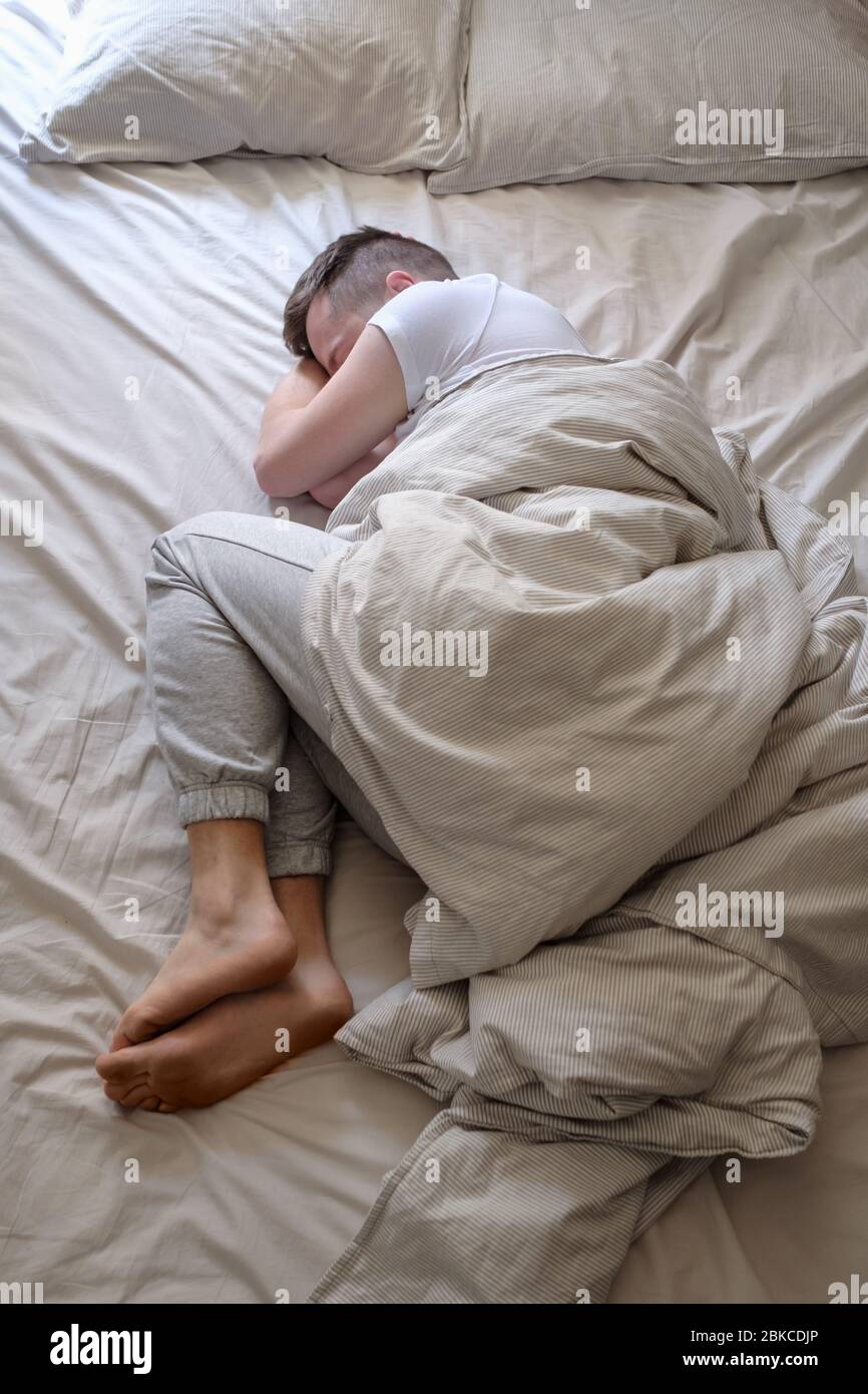 Man and sleeping alone and darkness hi-res stock photography and images ...