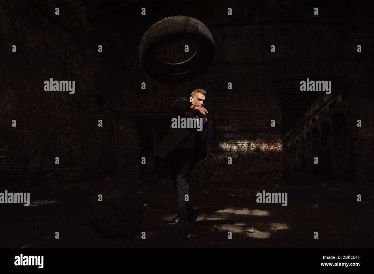 Man throwing the tire from the car Stock Photo - Alamy