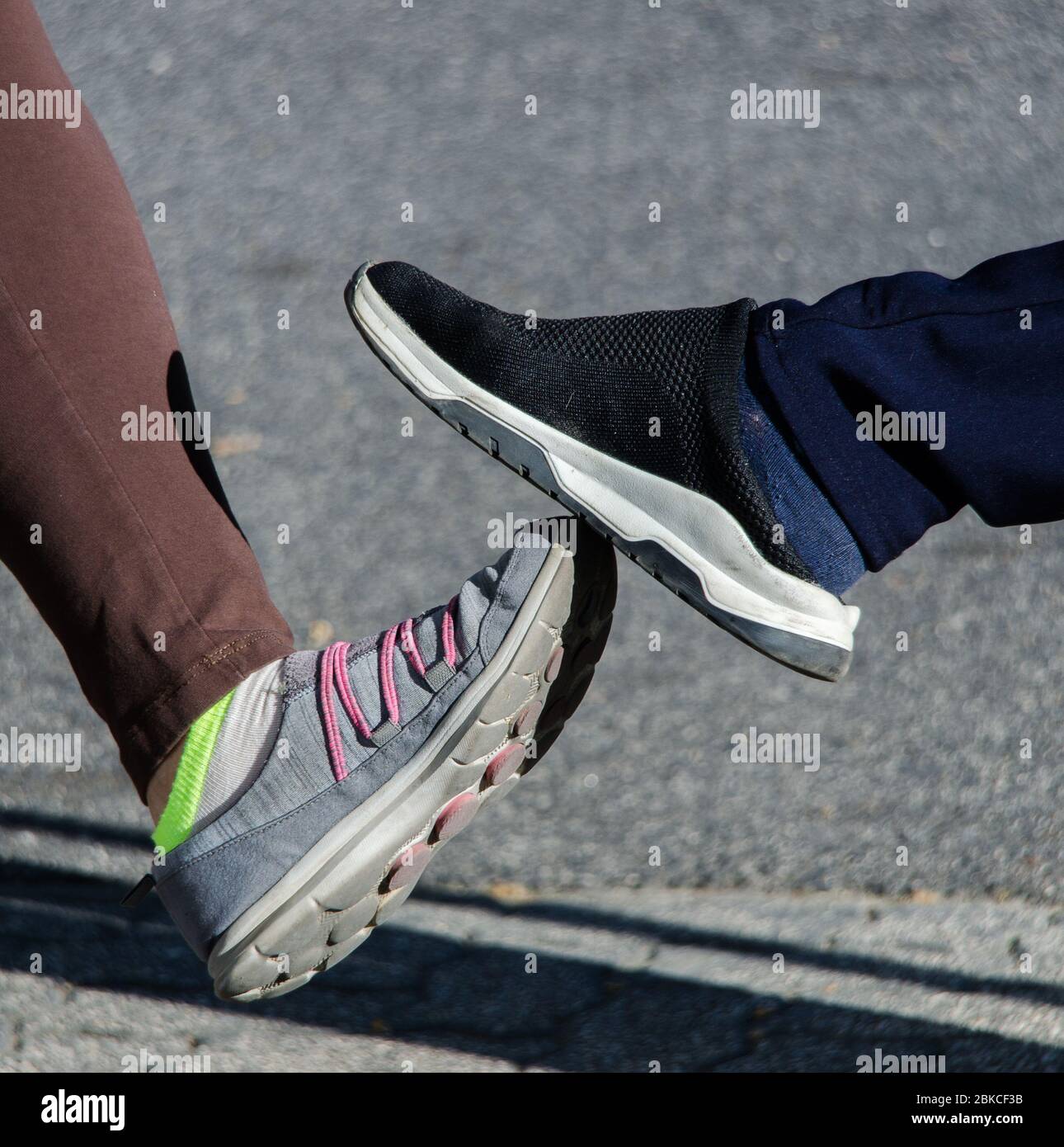 Foot tap. New novel greeting to avoid the spread of coronavirus. Two ...