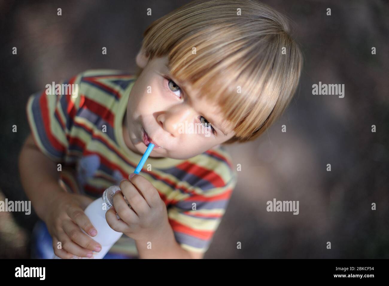 Child drinking through straw hi-res stock photography and images - Alamy