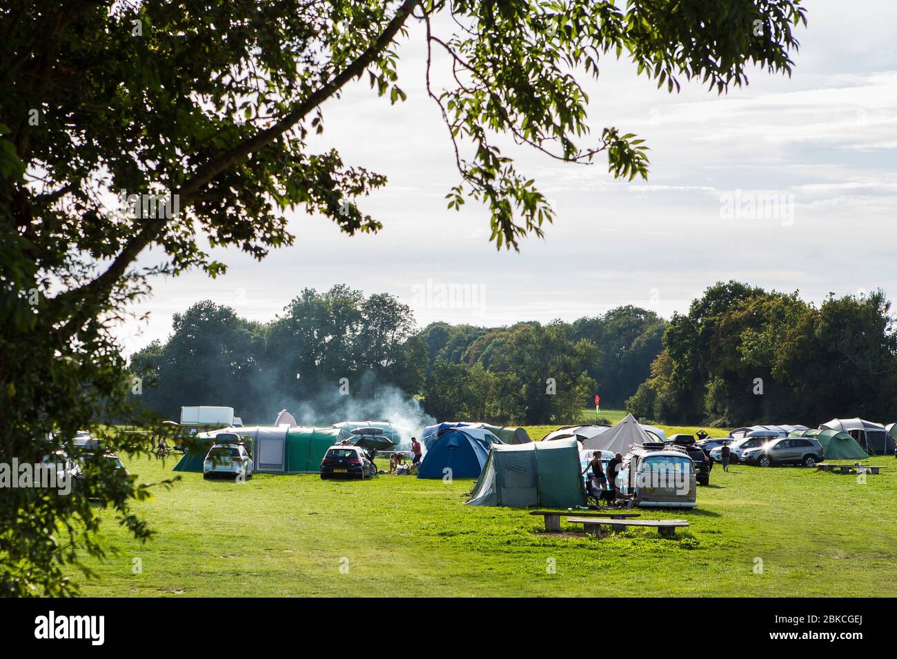 Wide shot of busy camping field at Wowo's, a family campsite in Sussex ...