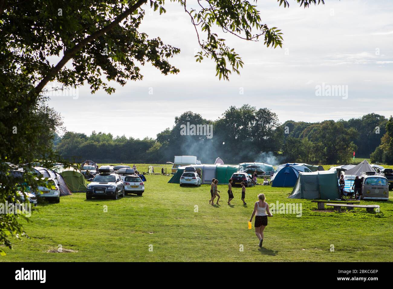 Wide shot of busy camping field at Wowo's, a family campsite in Sussex ...