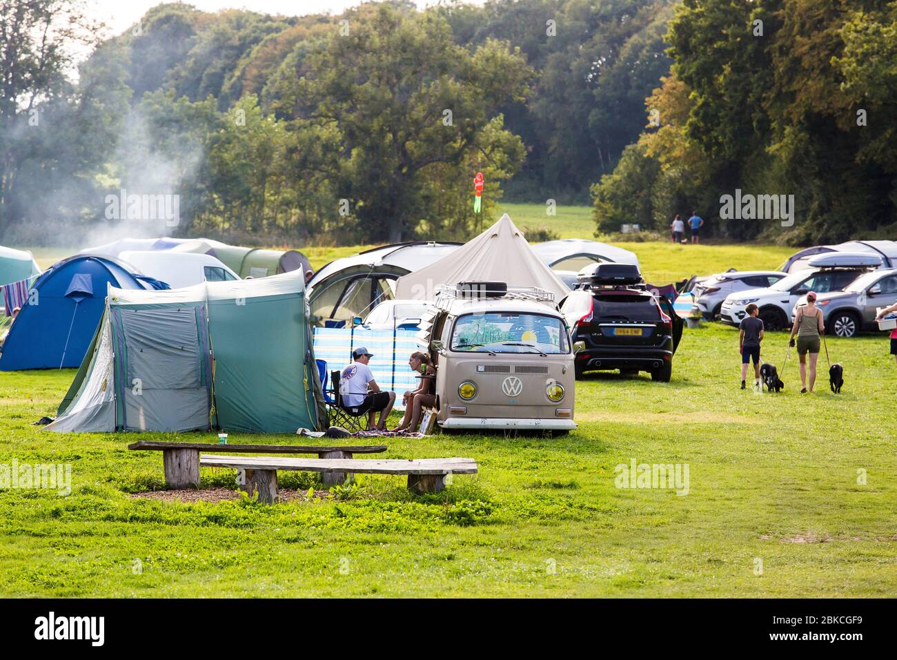 Wide shot of busy camping field at Wowo's, a family campsite in Sussex ...