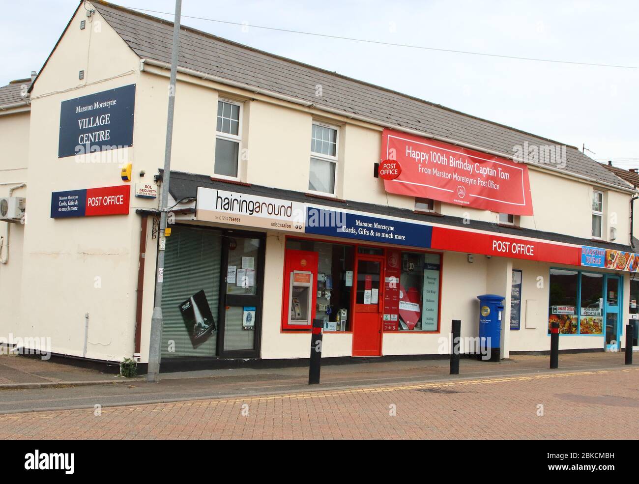 A blue Postbox outside Village Post office in Marson Moretaine.Royal ...