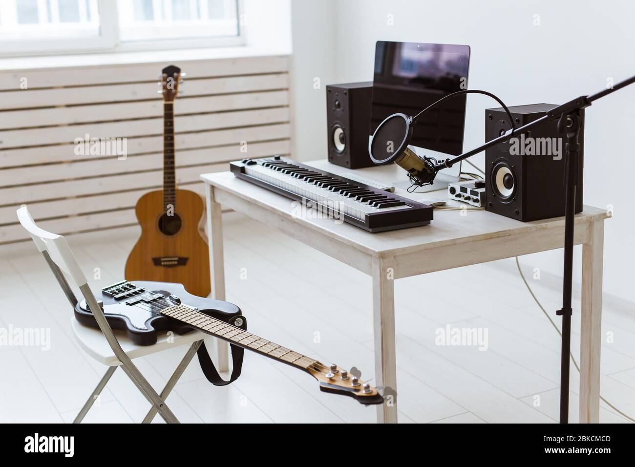 Microphone, computer and musical equipment guitars and piano background ...
