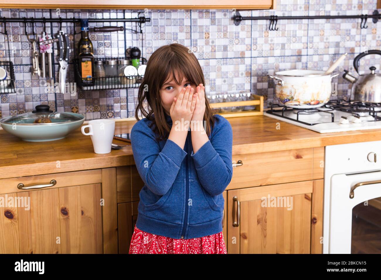 Little scared child girl hiding face. Fear concept Stock Photo - Alamy