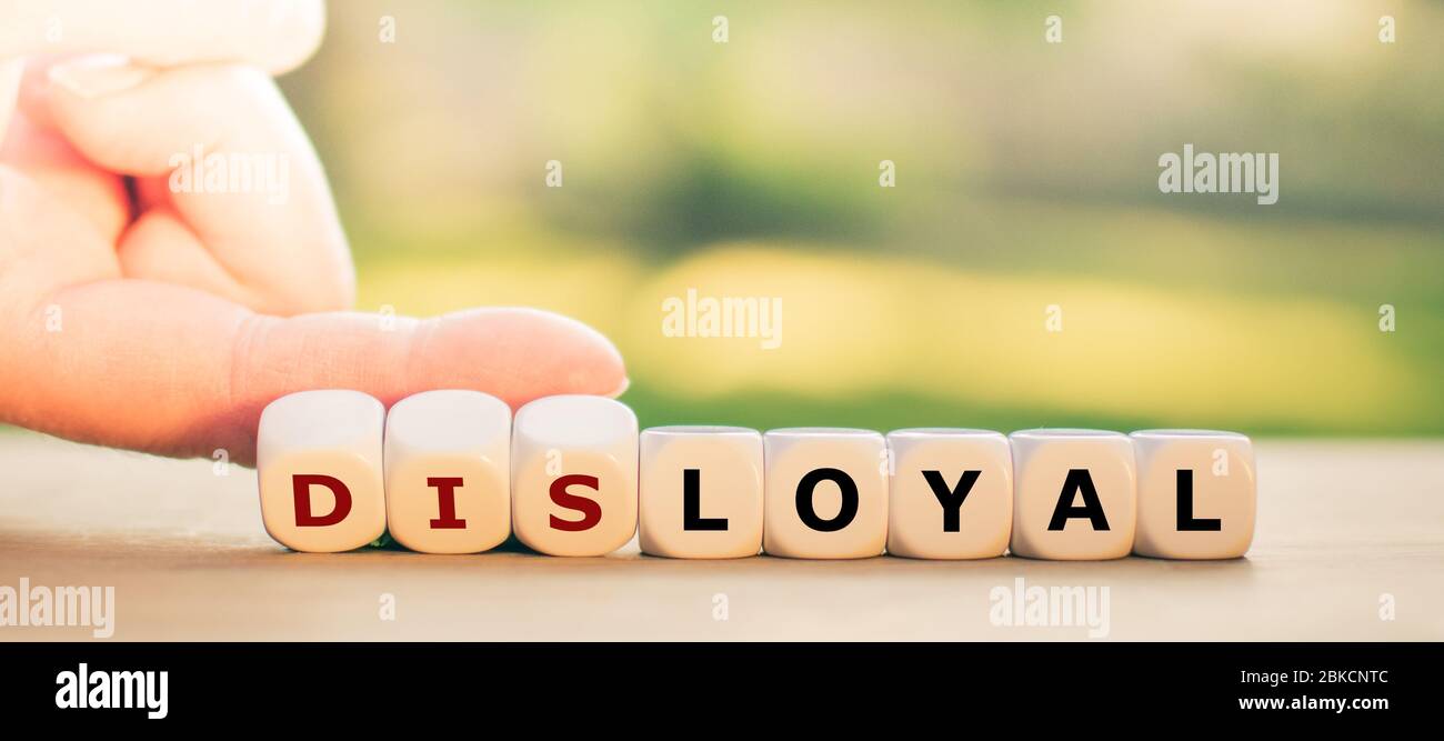 Hand turns dice and changes the expression "disloyal" to "loyal Stock ...
