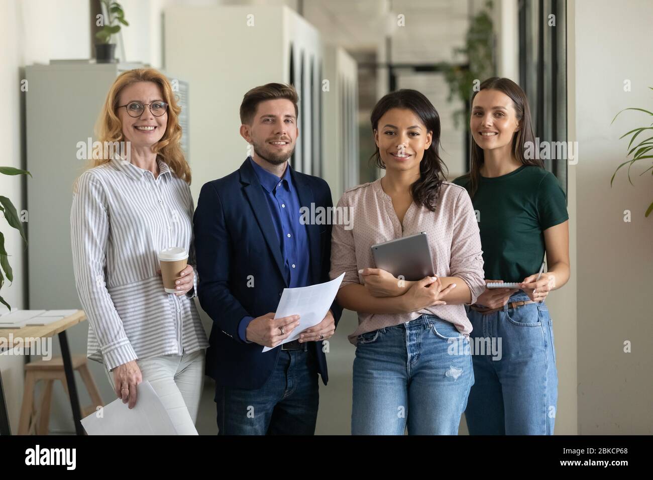 Portrait of smiling diverse mixed race employees team Stock Photo - Alamy