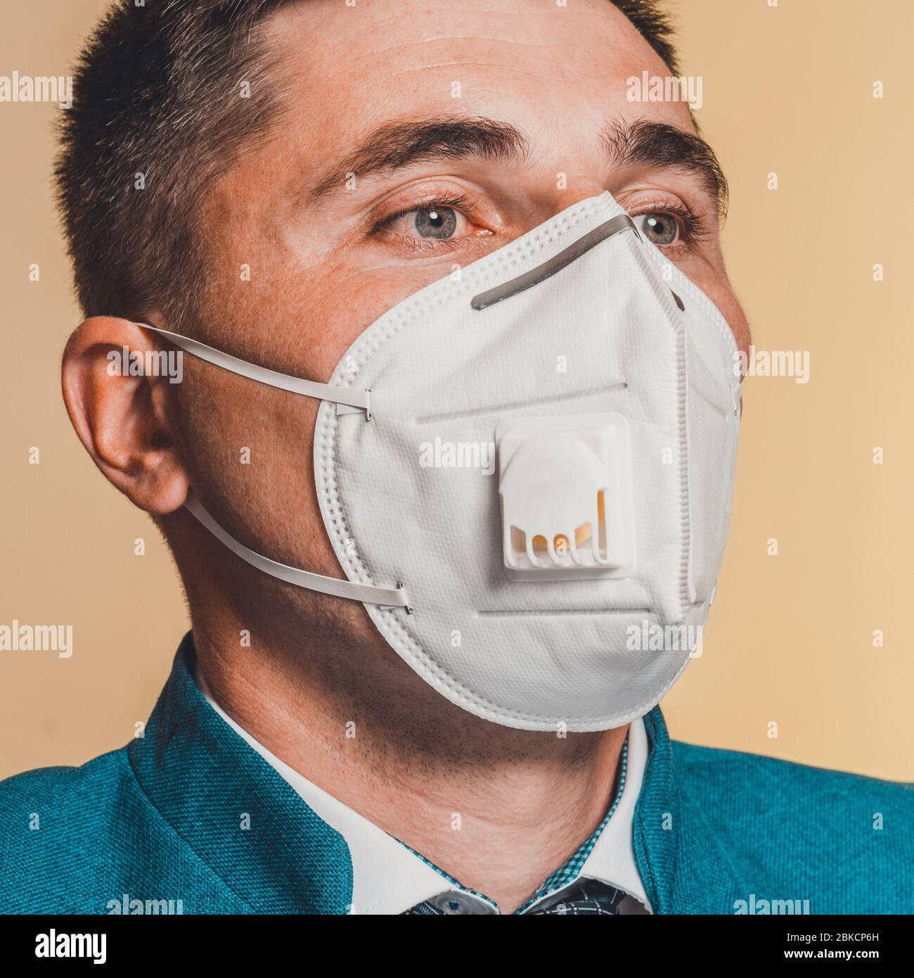 Closeup of face male patient in face shield on self isolation during ...