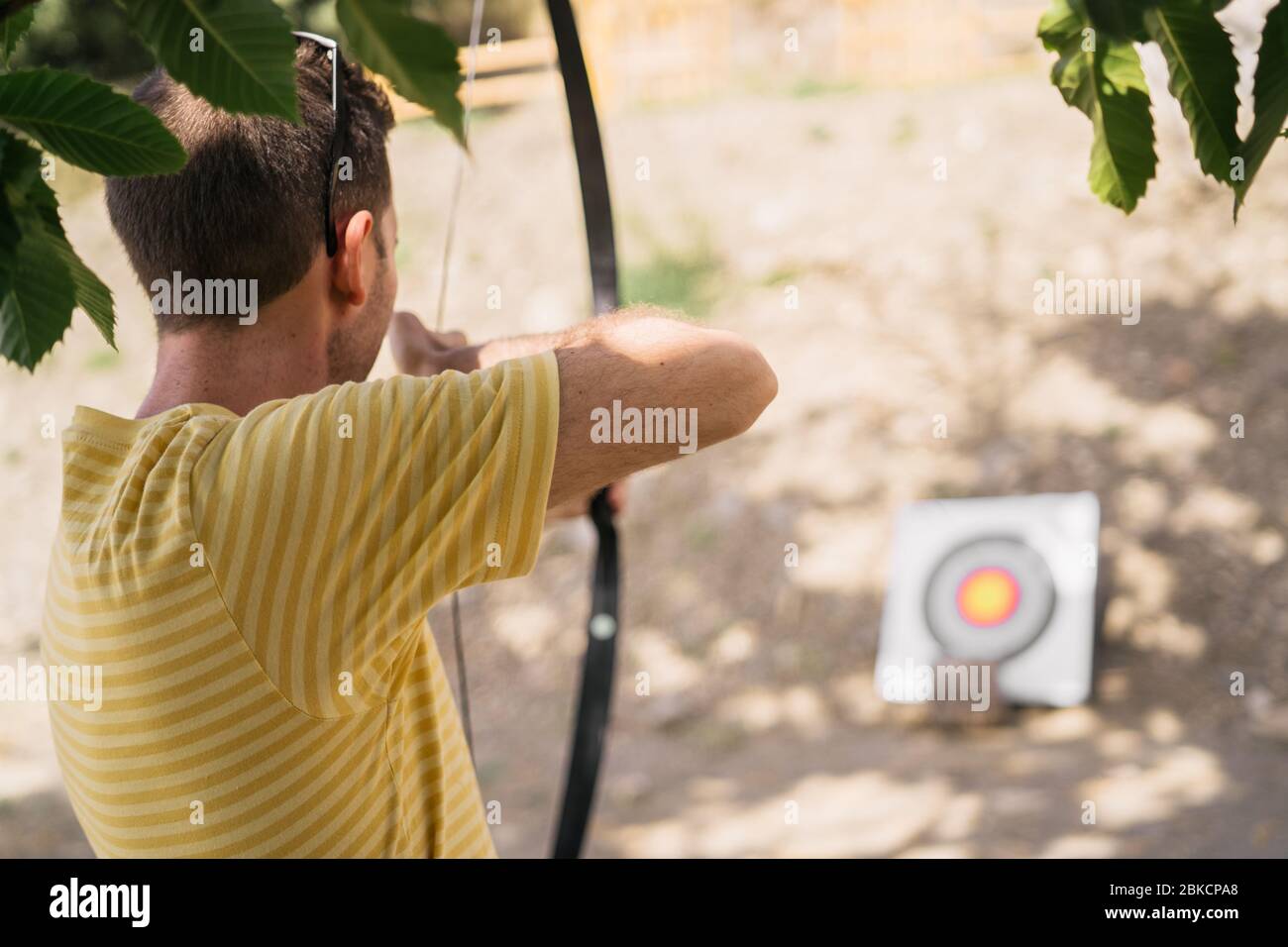 Archery. Man practicing Archer exercise with the bow. Sport, recreation ...