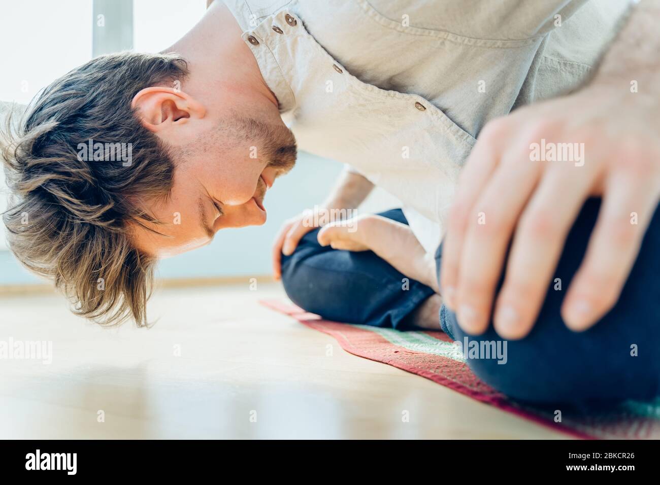 Man practice yoga. Young attractive male doing breathing exercises. Guy ...