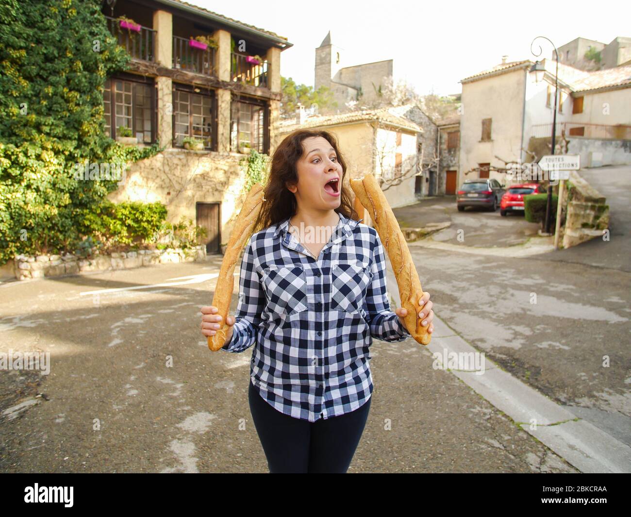 Funny picture of crazy woman eating tasty loaf. Overweight, overeating ...