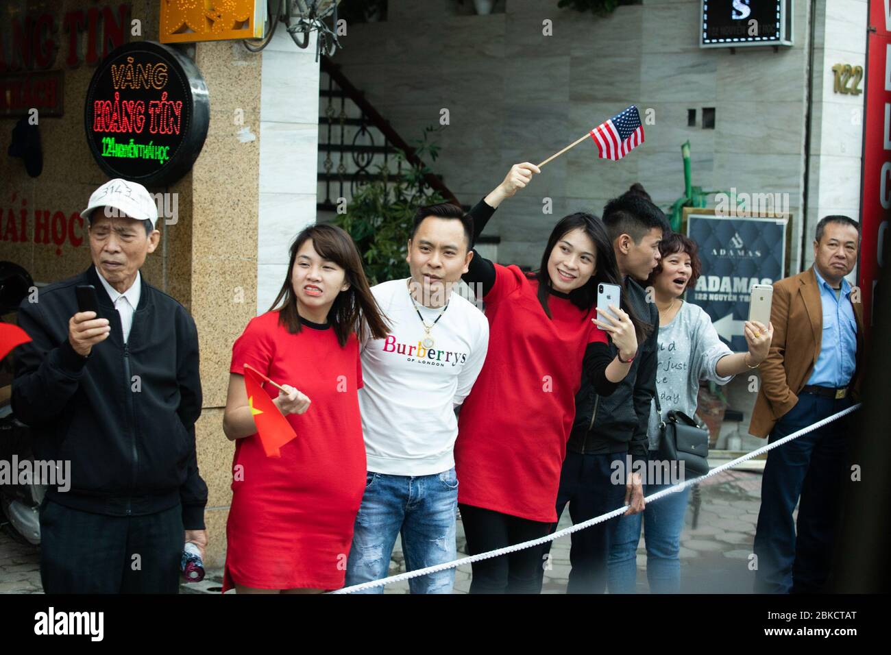 Crowds gathered to watch the motorcade of President Donald J. Trump on ...