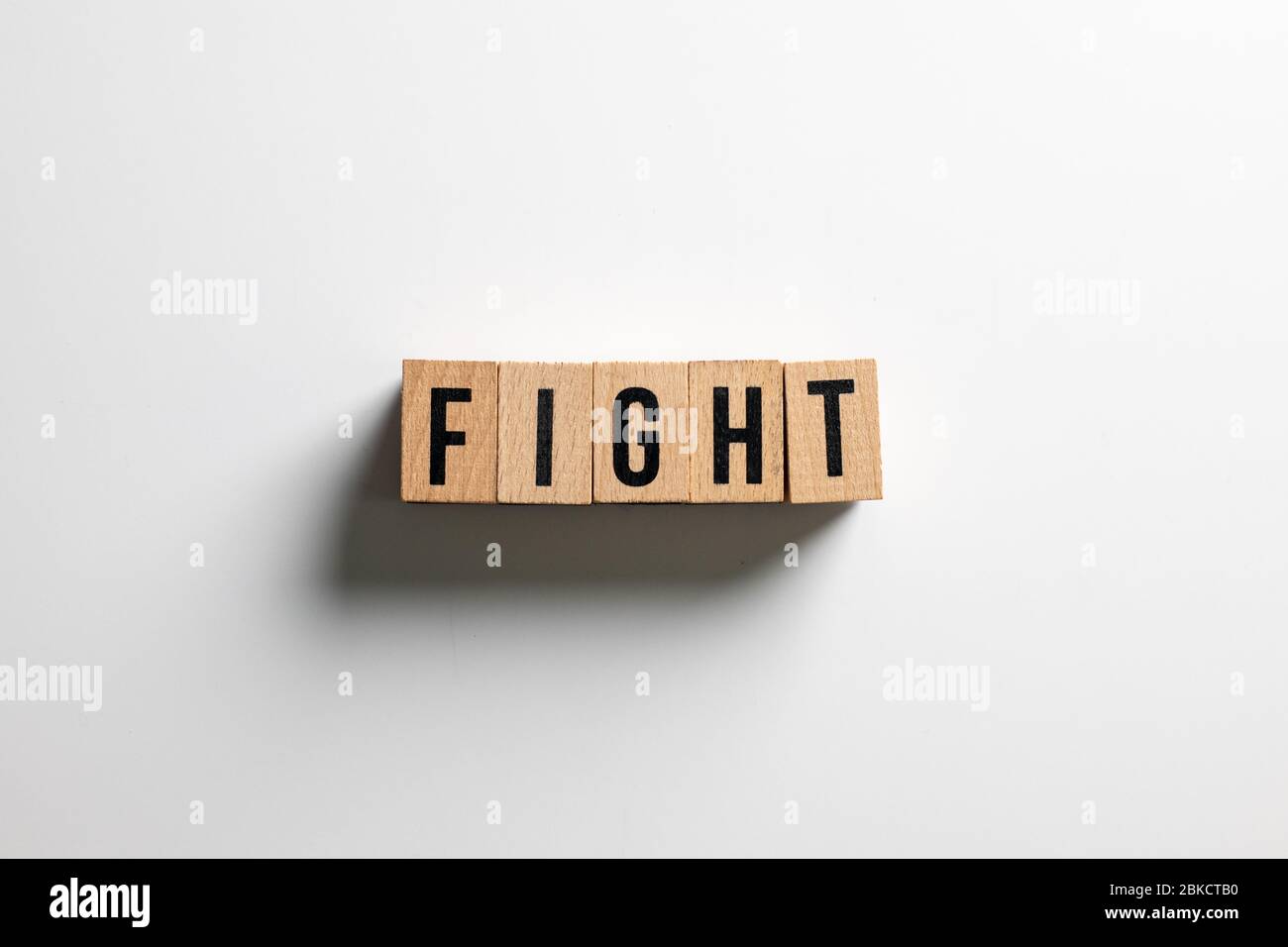 " fight " text made of wooden cube on White background Stock Photo - Alamy
