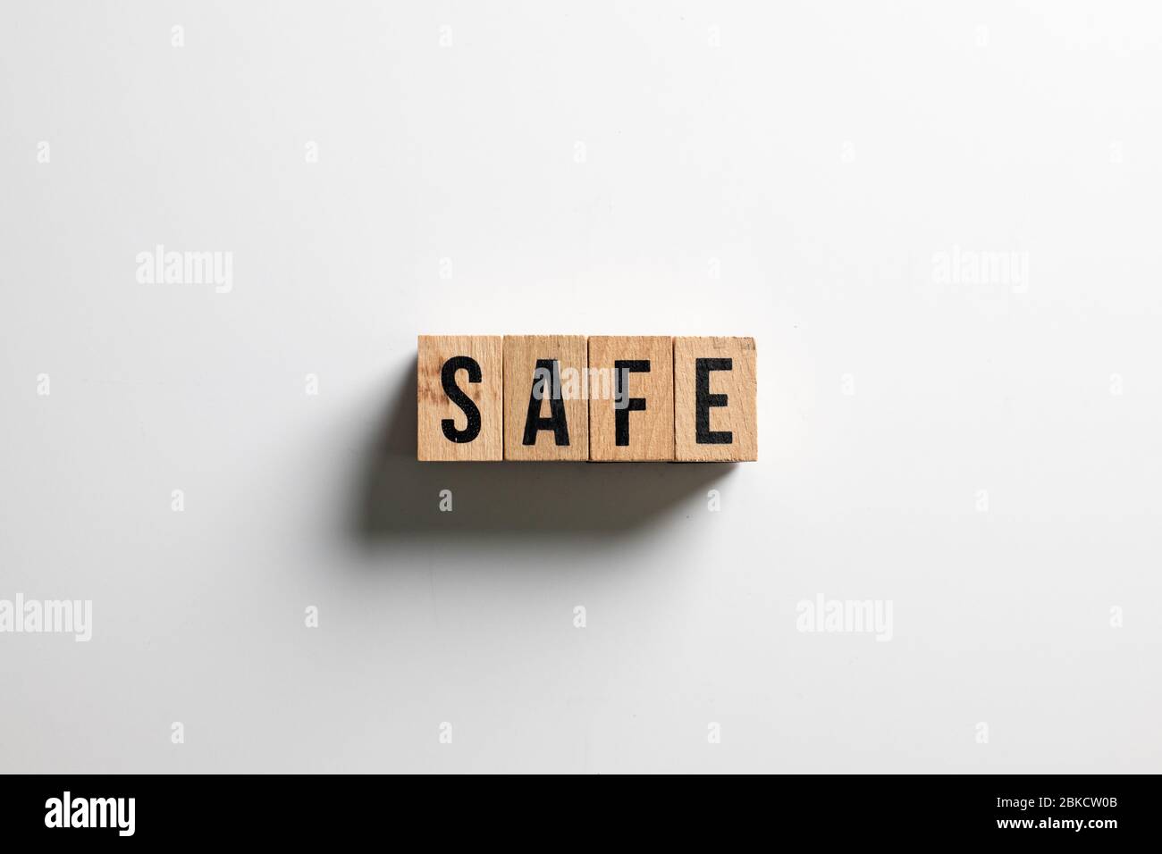 " safe " text made of wooden cube on White background Stock Photo - Alamy
