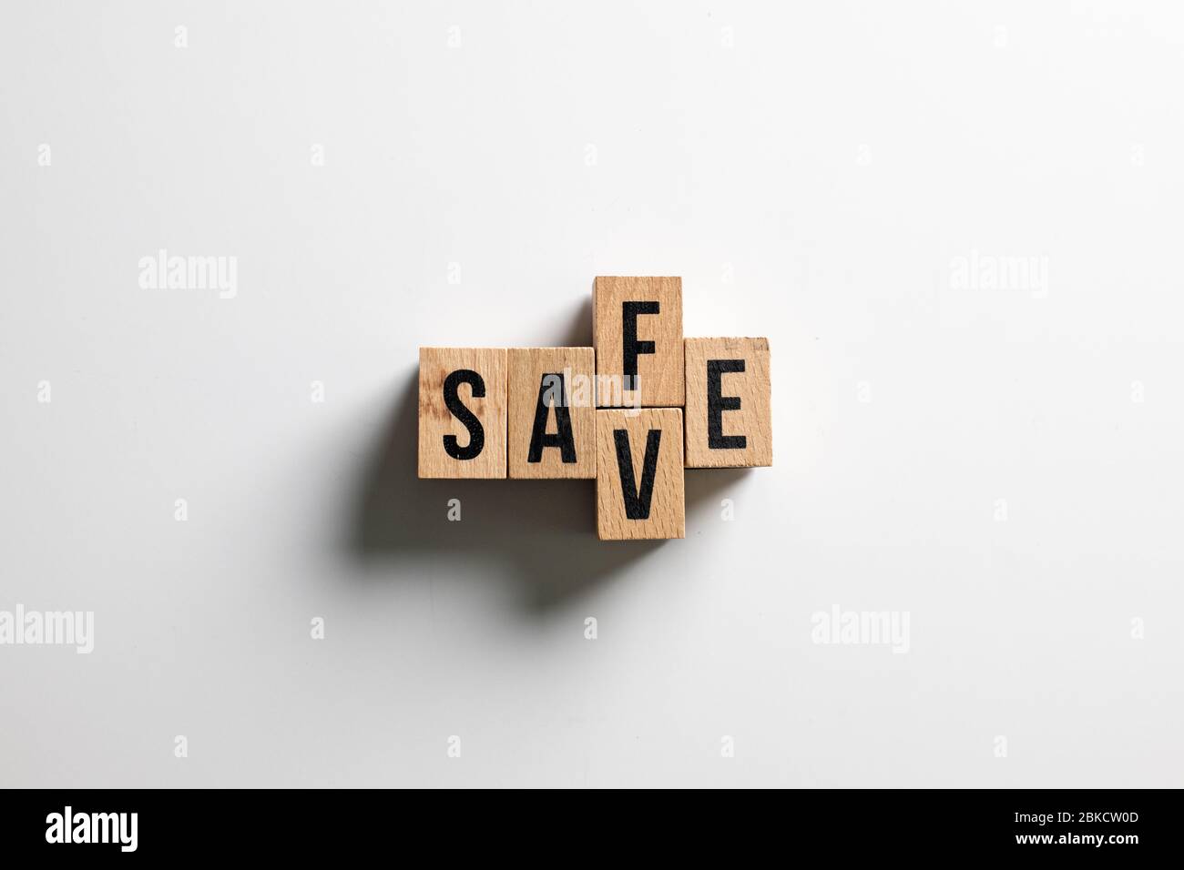 " save or safe " text made of wooden cube on White background Stock ...