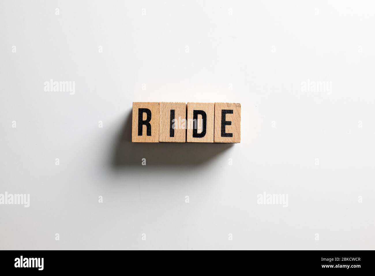 " ride " text made of wooden cube on White background Stock Photo - Alamy