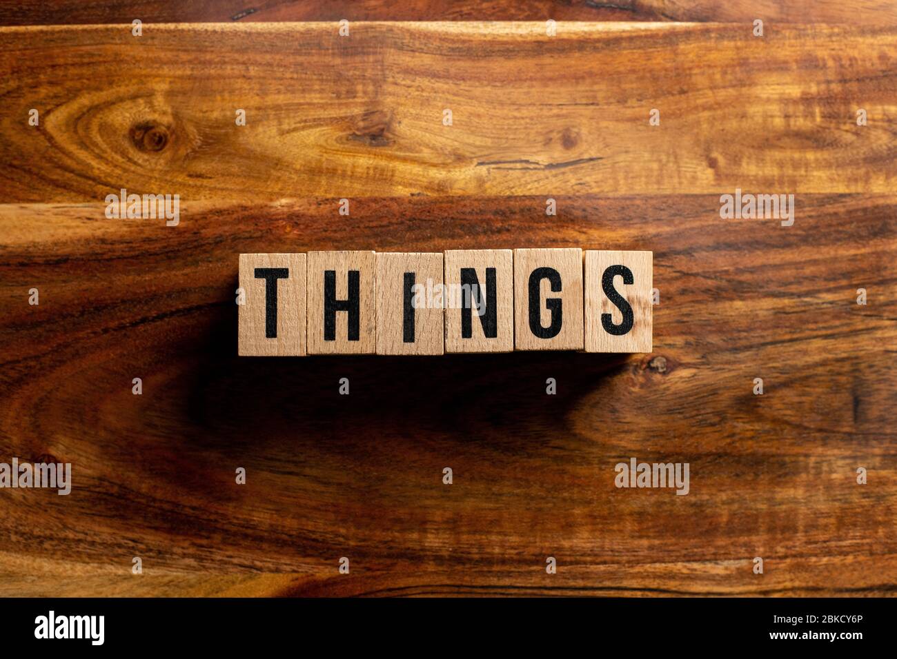 " things " text made of wooden cube on wooden background Stock Photo ...