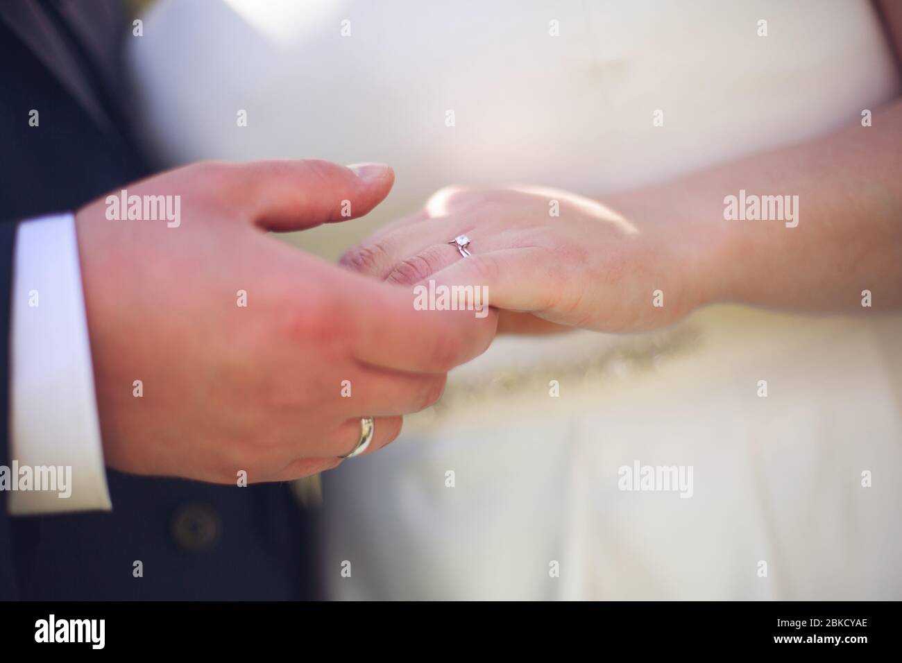 The hands of lovers holding each other with rings on their hands Stock ...