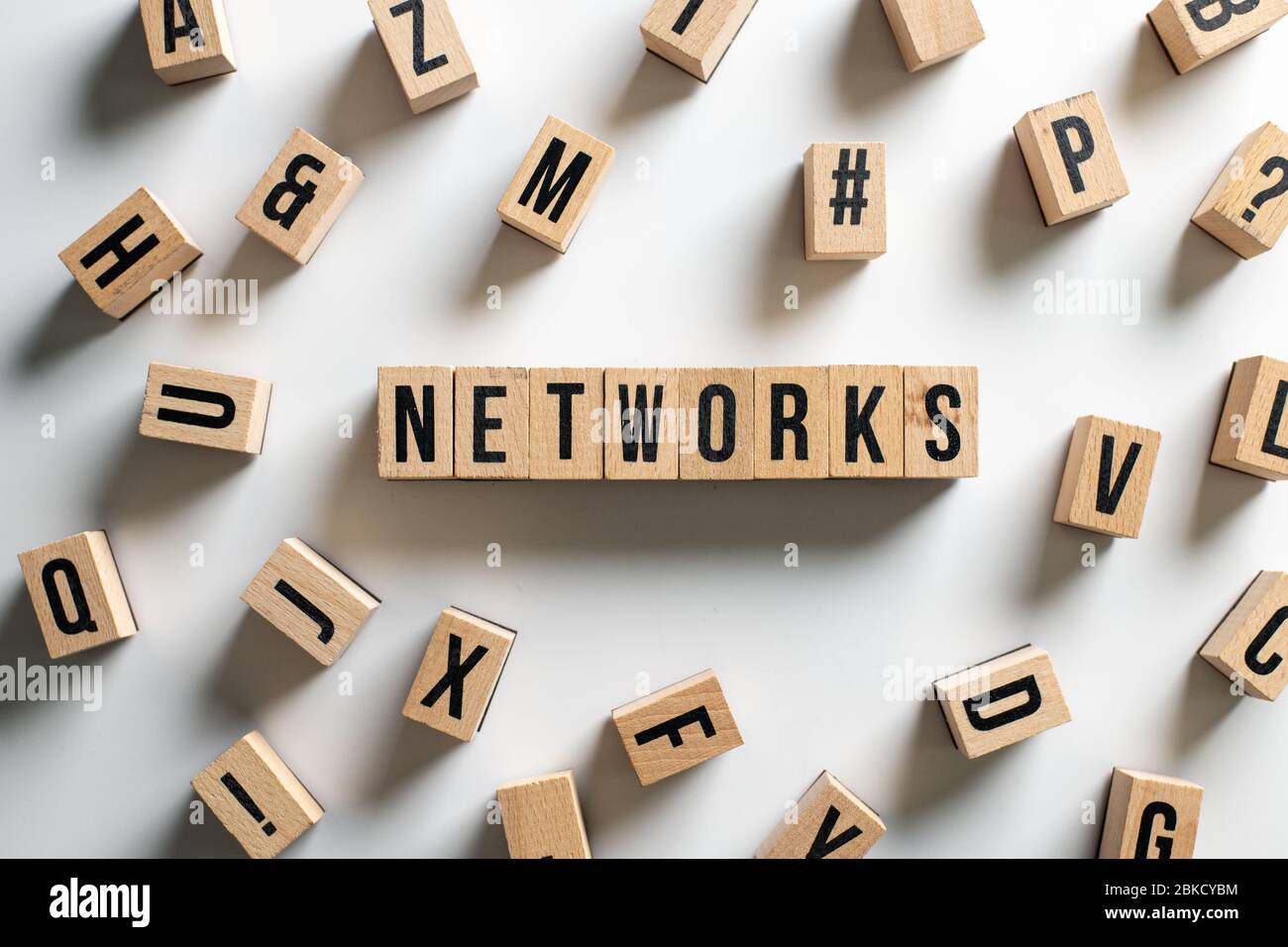 " networks " text made of wooden cube on White background with pile ...