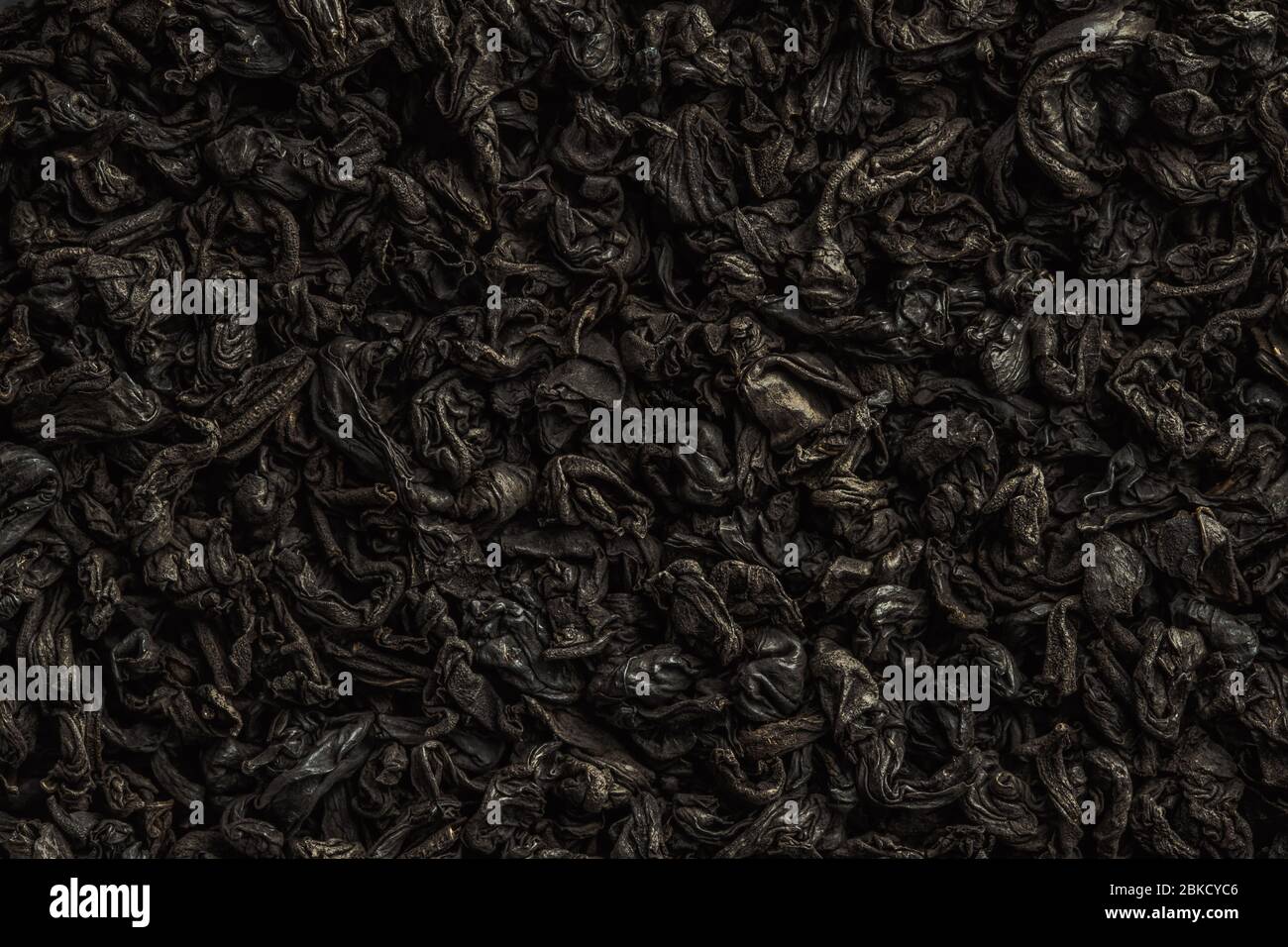 Texture of tea. Dry black tea leaves Stock Photo - Alamy