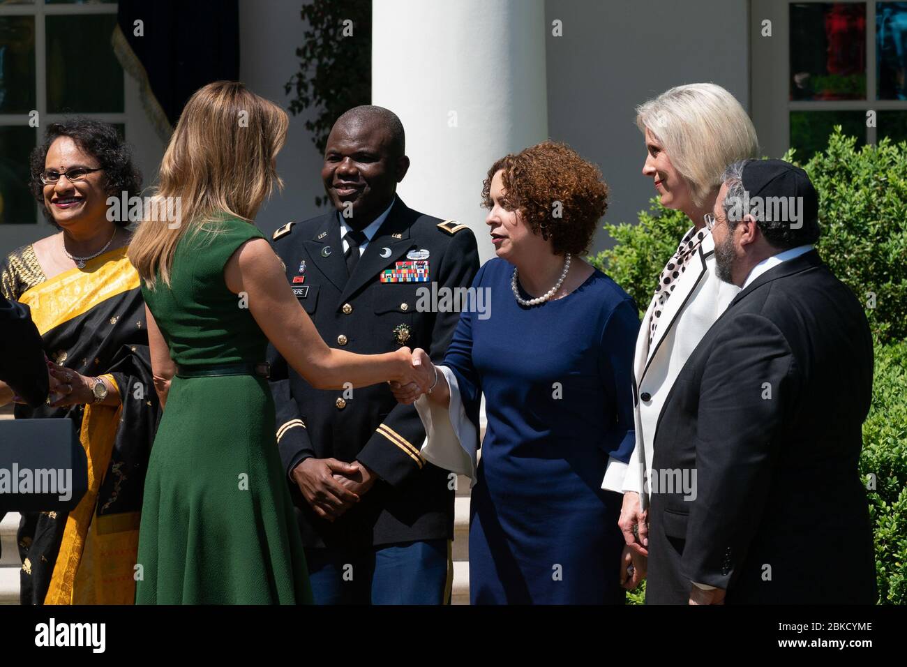 First Lady Melania Trump shakes hands with Pastor Marilyn Rivera following the National Day of ...