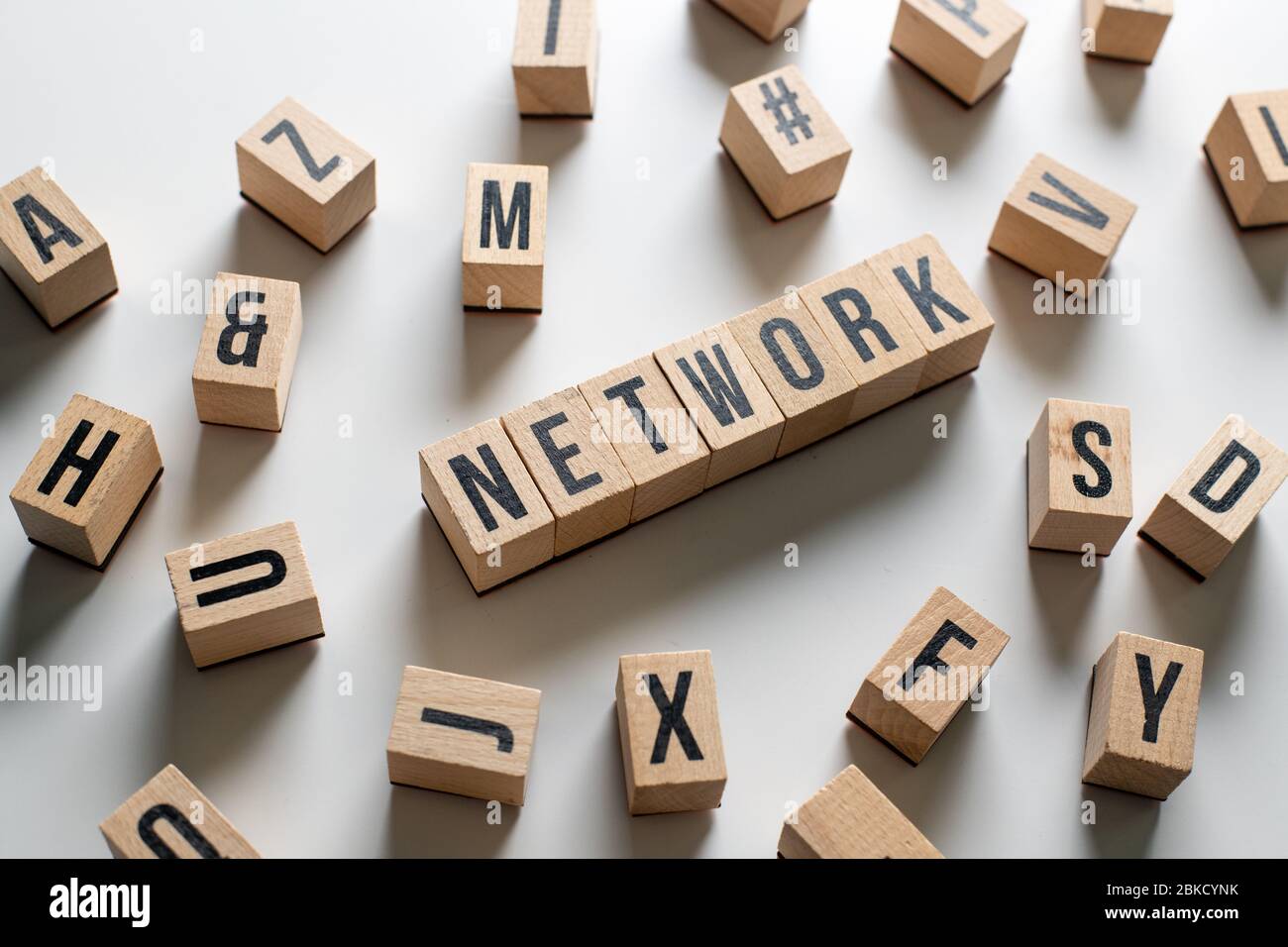 " network " text made of wooden cube on White background with pile ...