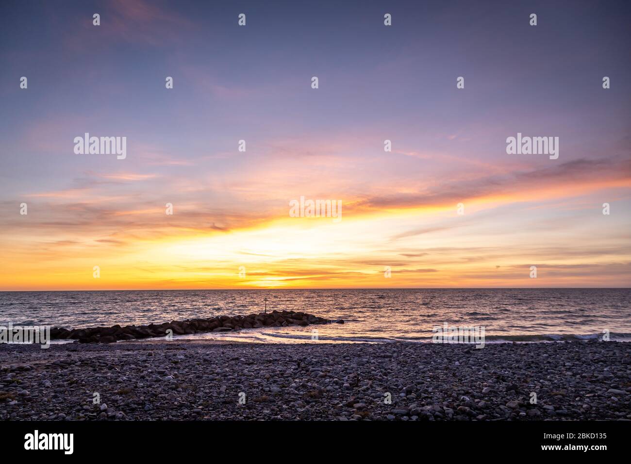 Sunset over Borth beach, Ceredigion, Wales, UK Stock Photo - Alamy