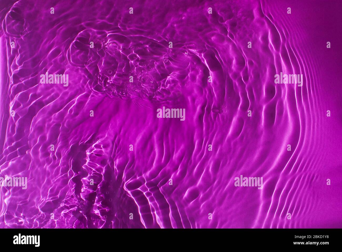 Abstract violet background of waves and ripples on the water Stock ...