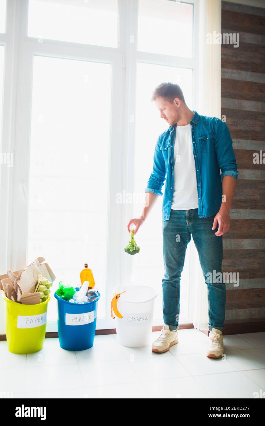 close-up concept. Sort garbage at home. There are three buckets for ...