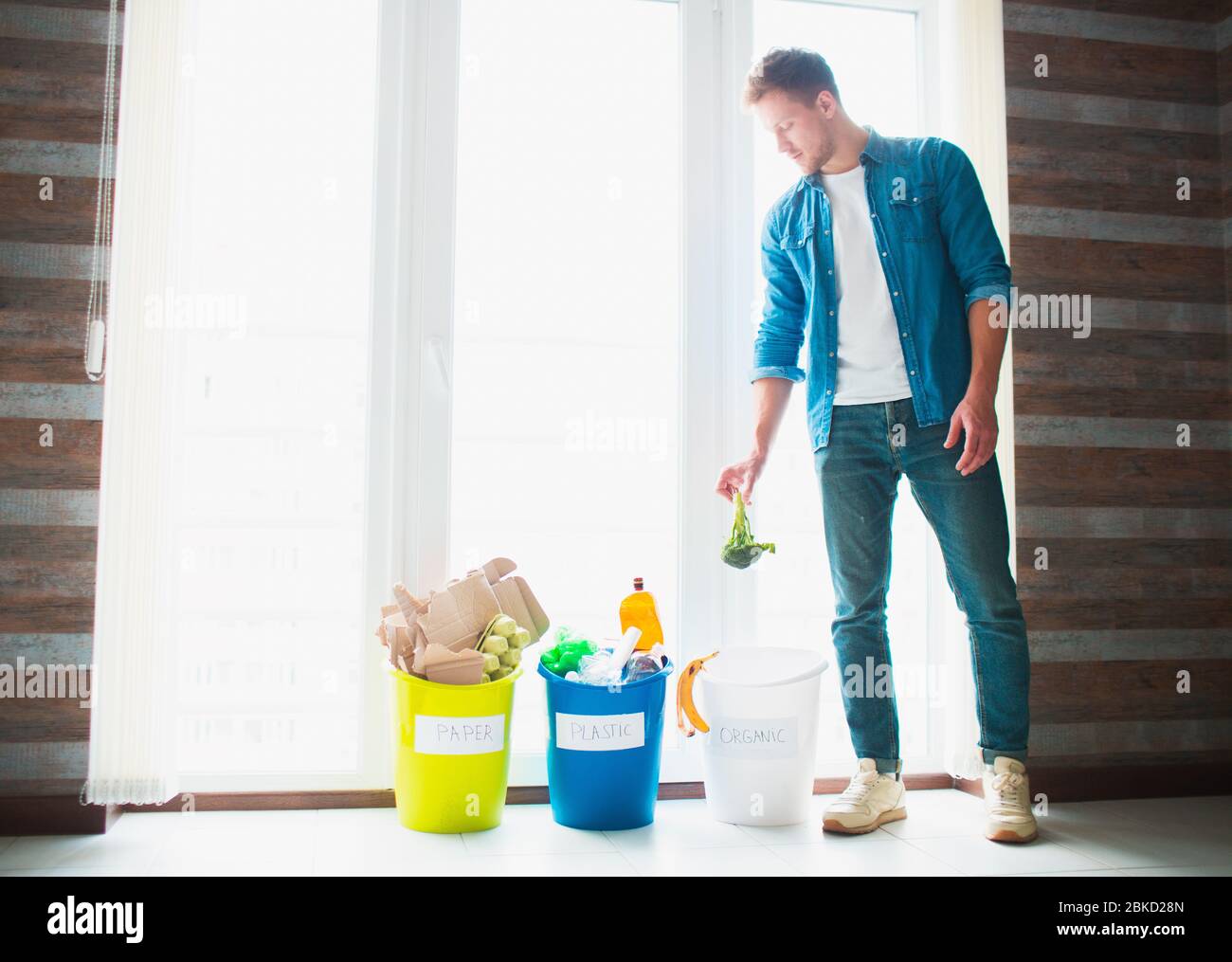 close-up concept. Sort garbage at home. There are three buckets for ...