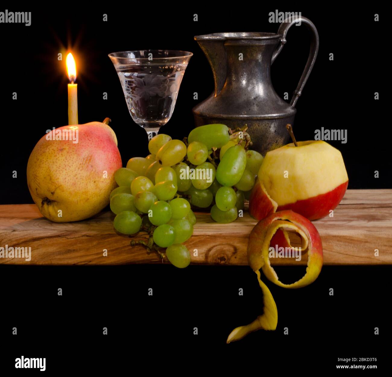 A still life with fruits, an apple, a peach and grapes, a jar of tin ...