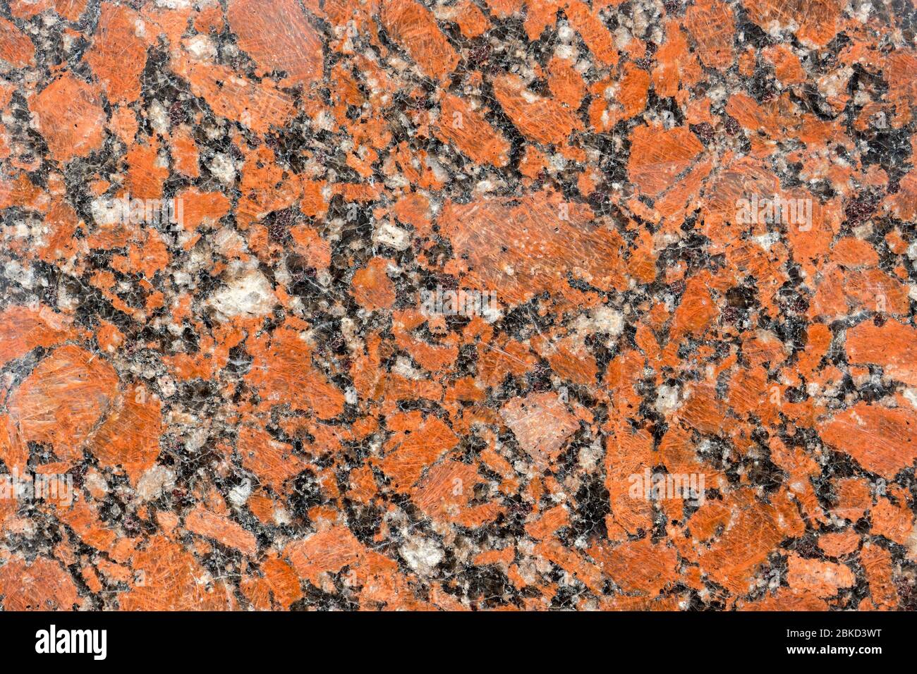 natural drawing of granitic surface with rich red hue, coarse-grained ...