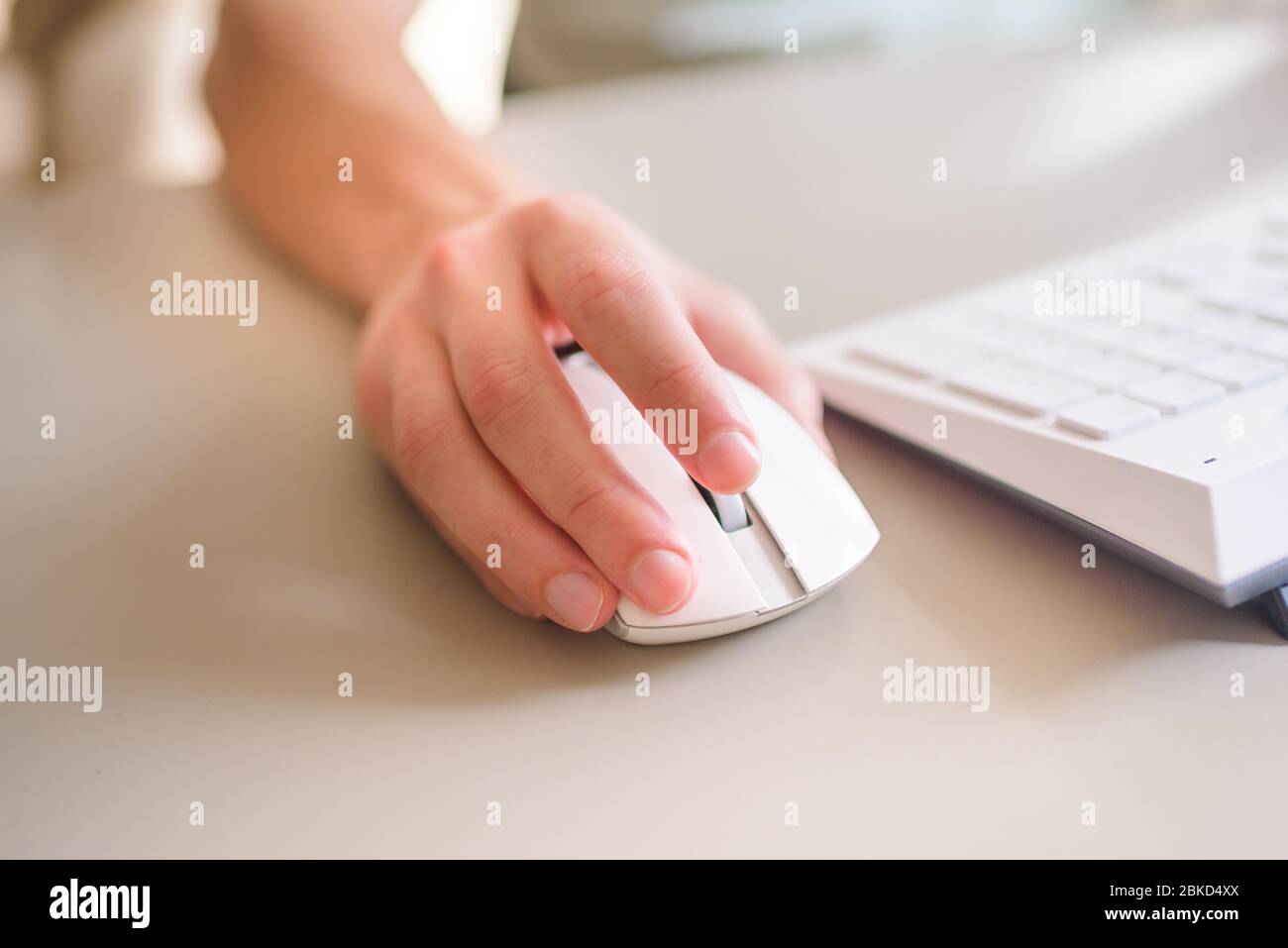 close up hand business man using mouse and laptop in office with ...