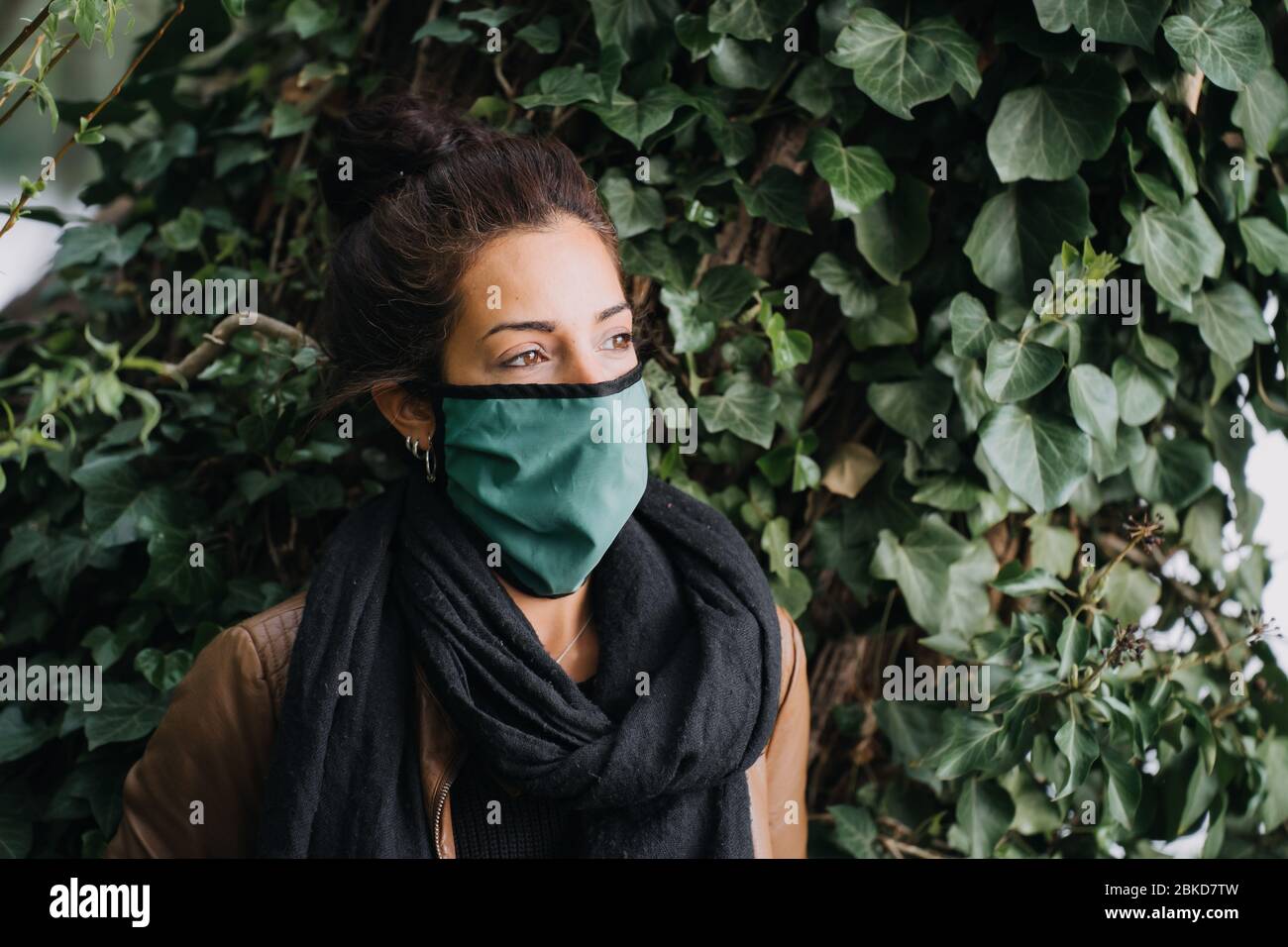 photo of a woman in the forest wearing a face mask Stock Photo - Alamy