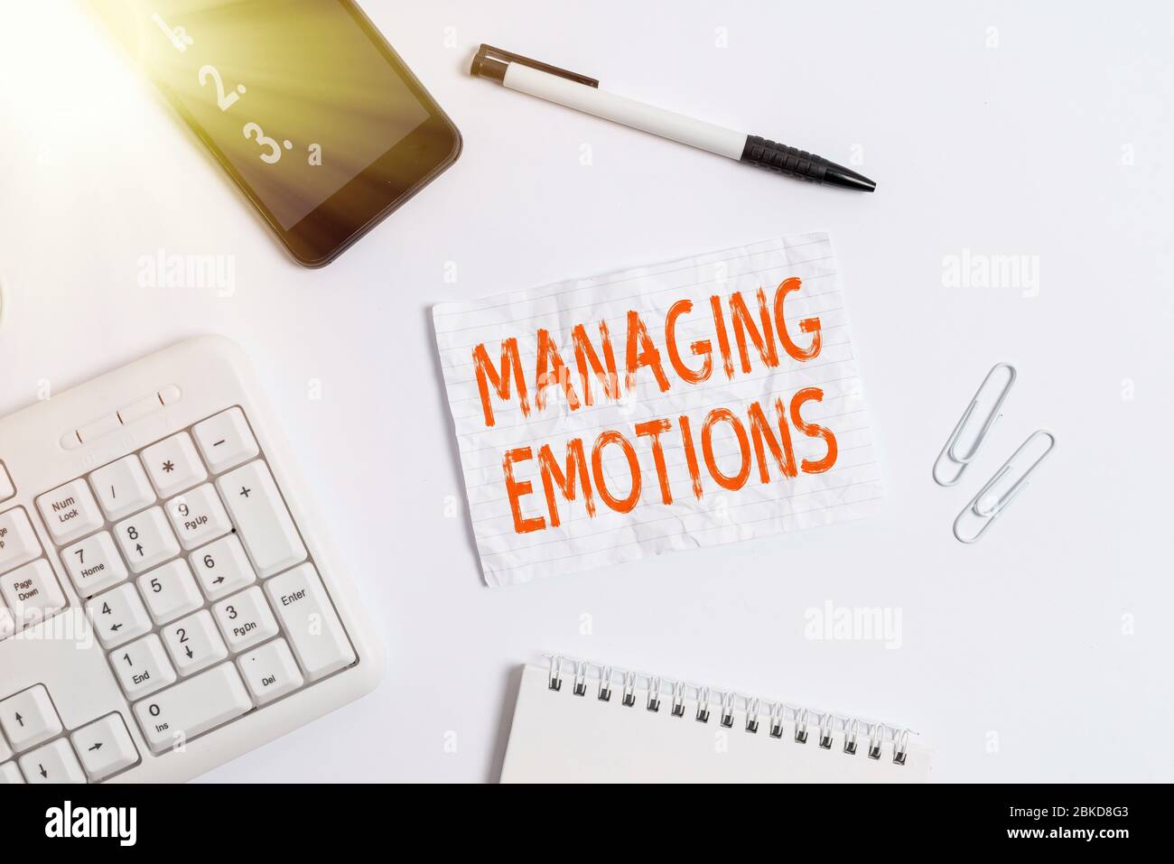 Writing note showing Managing Emotions. Business concept for ...